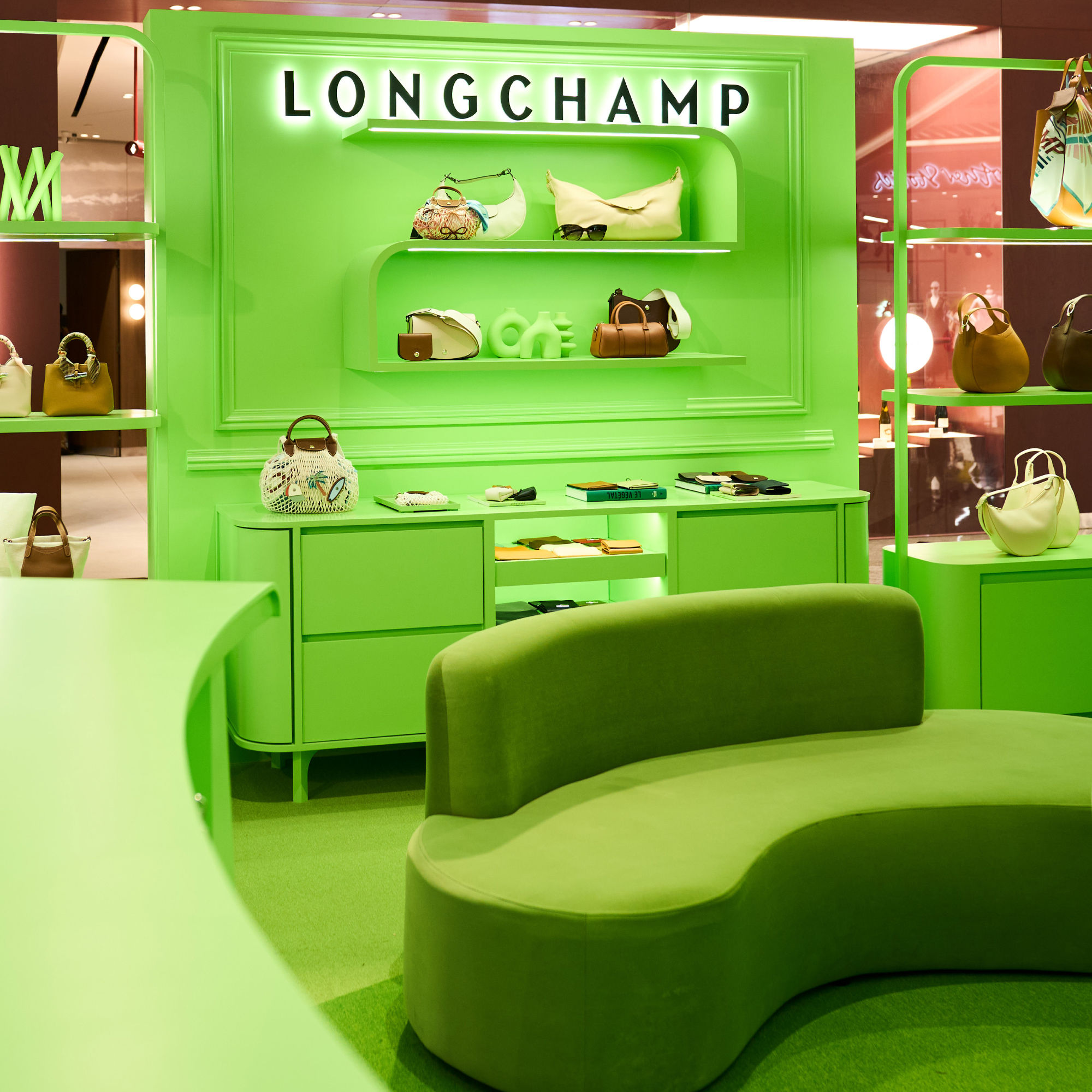 Longchamp debuts a popping green Raffles City store in Singapore